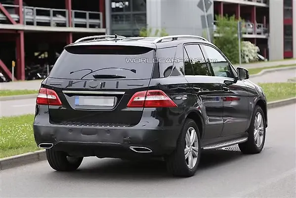 The 2015 Mercedes ML-Class spied with minimal camouflage - CarWale