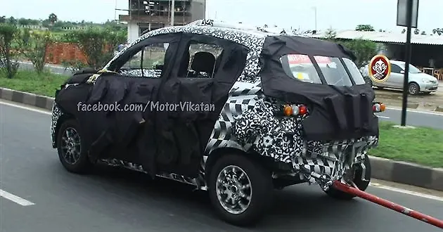 Mahindra S-101spied testing; front fascia revealed - CarWale