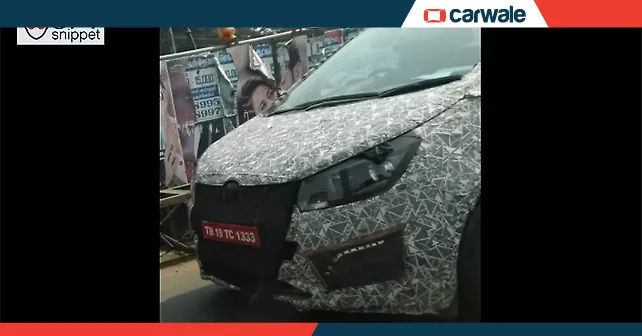 Mahindra’s upcoming MPV spotted testing with production headlamps - CarWale