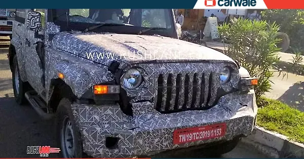 Next-gen Mahindra Thar spied again, new details leaked - CarWale