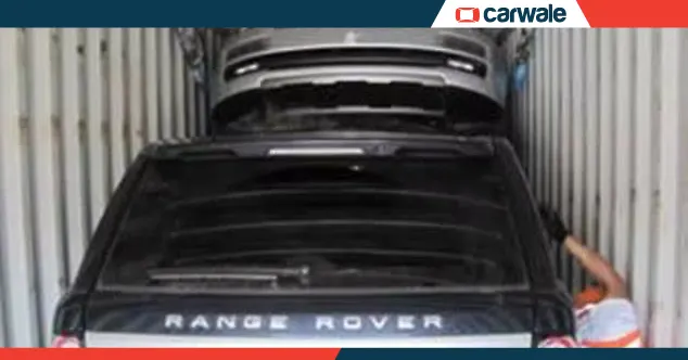 Four Range Rovers squeezed inside one shipping container defies logic ...