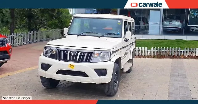 Mahindra Bolero with new logo arrives at dealer stockyard - CarWale