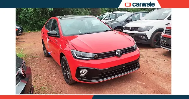 Volkswagen Virtus in New Flash Red Colour Reaches Local Dealers - CarWale