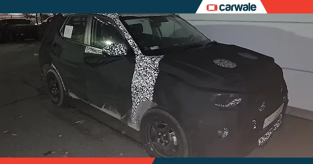 Kia QYI compact SUV spotted yet again - CarWale