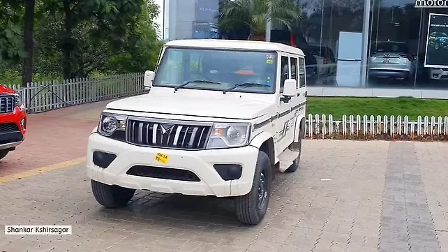 Mahindra Bolero with new logo arrives at dealer stockyard - CarWale
