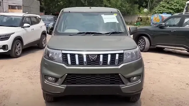 Mahindra Bolero Neo with new logo spotted at dealer yard - CarWale