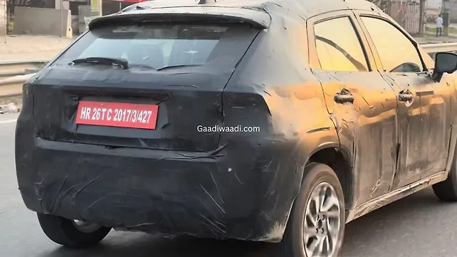 Maruti Baleno Coupe spied again; new details revealed - CarWale