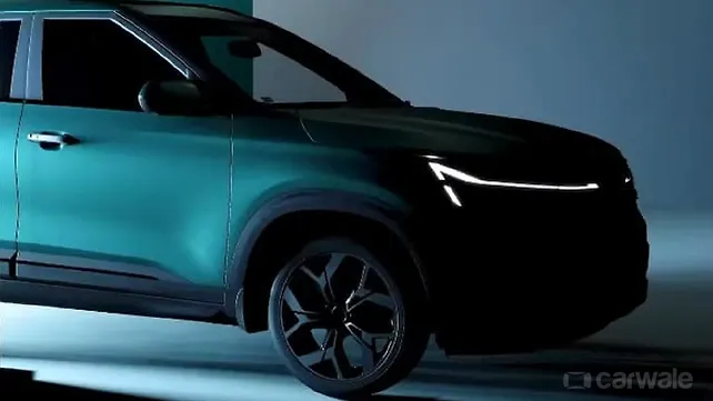 Kia Seltos facelift teased again; to get a matte green colour? - CarWale