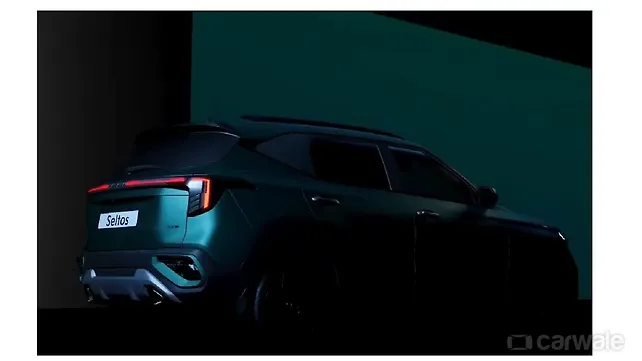 Kia Seltos facelift teased again; to get a matte green colour? - CarWale