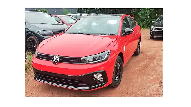 Volkswagen Virtus in New Flash Red Colour Reaches Local Dealers - CarWale